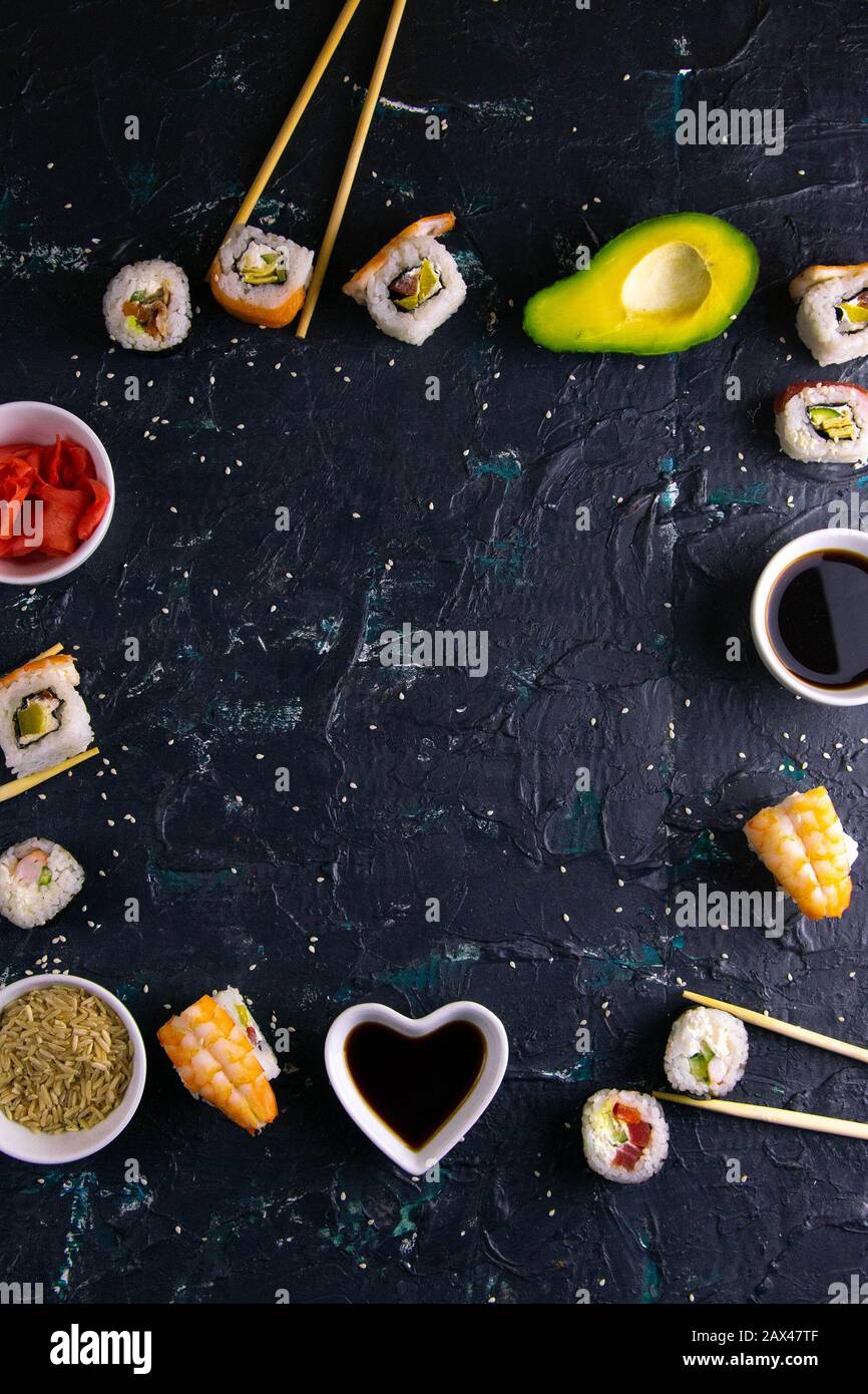 Different roles, avocado, red marinated ginger, rice, soy sauce are ...