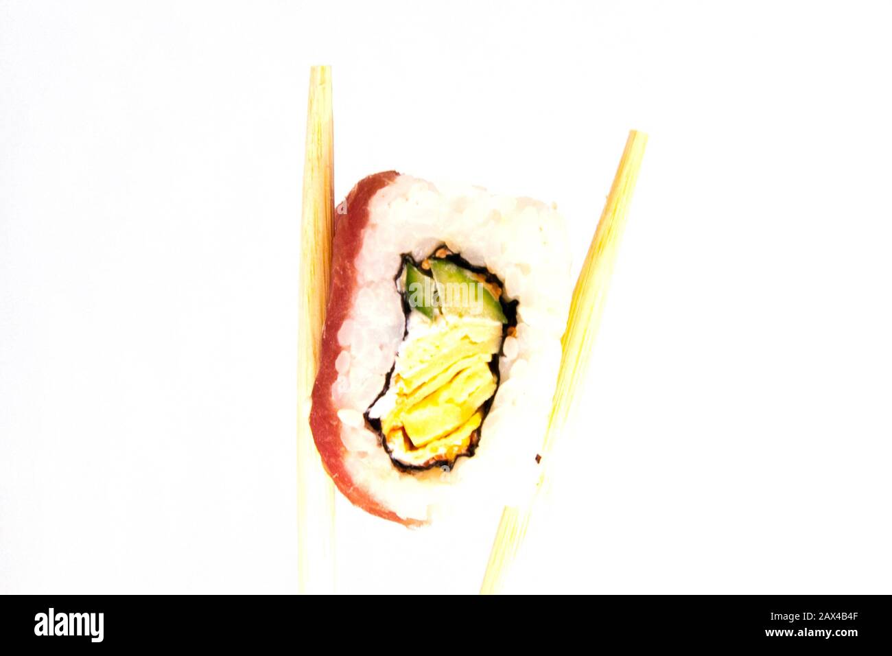 Roll maguro isolated on a black background Stock Photo - Alamy