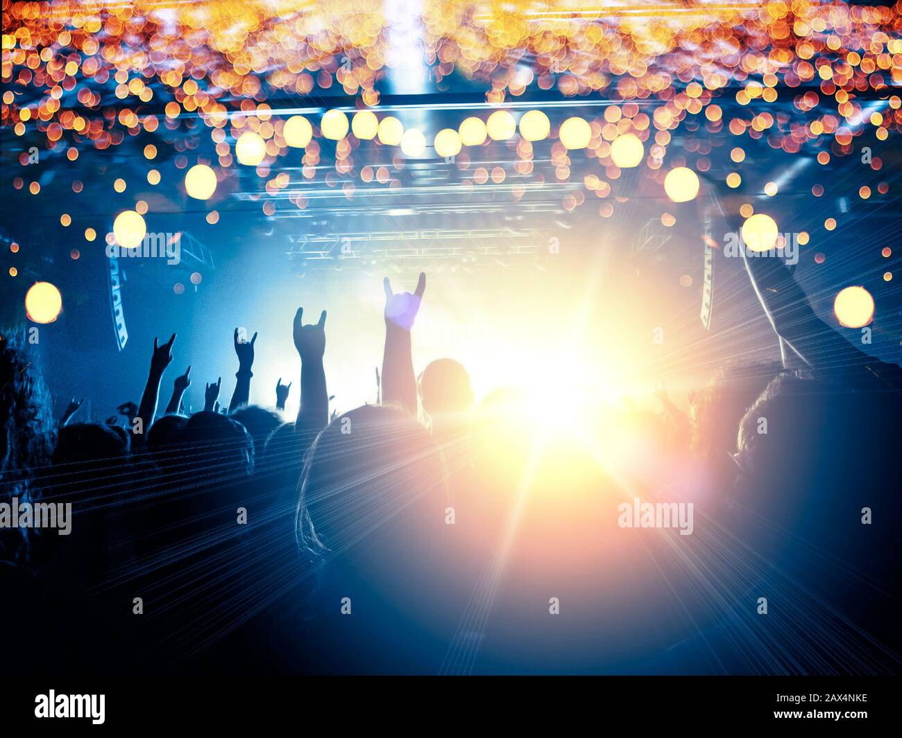Concert shot with people clapping the band Stock Photo - Alamy