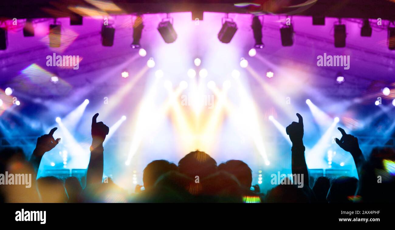 Concert shot with people clapping the band Stock Photo - Alamy