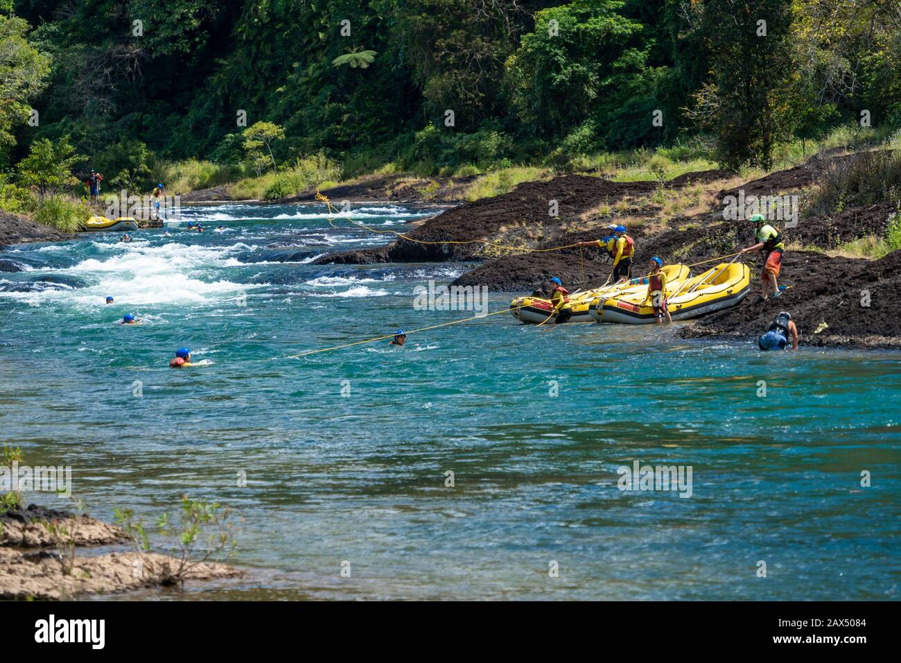 White water rafters being assisted after floating over rapids at Tully ...