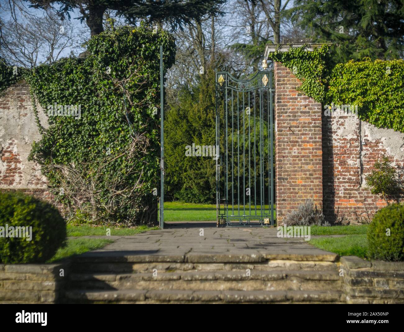 Gate to an inner section of a park Stock Photo - Alamy