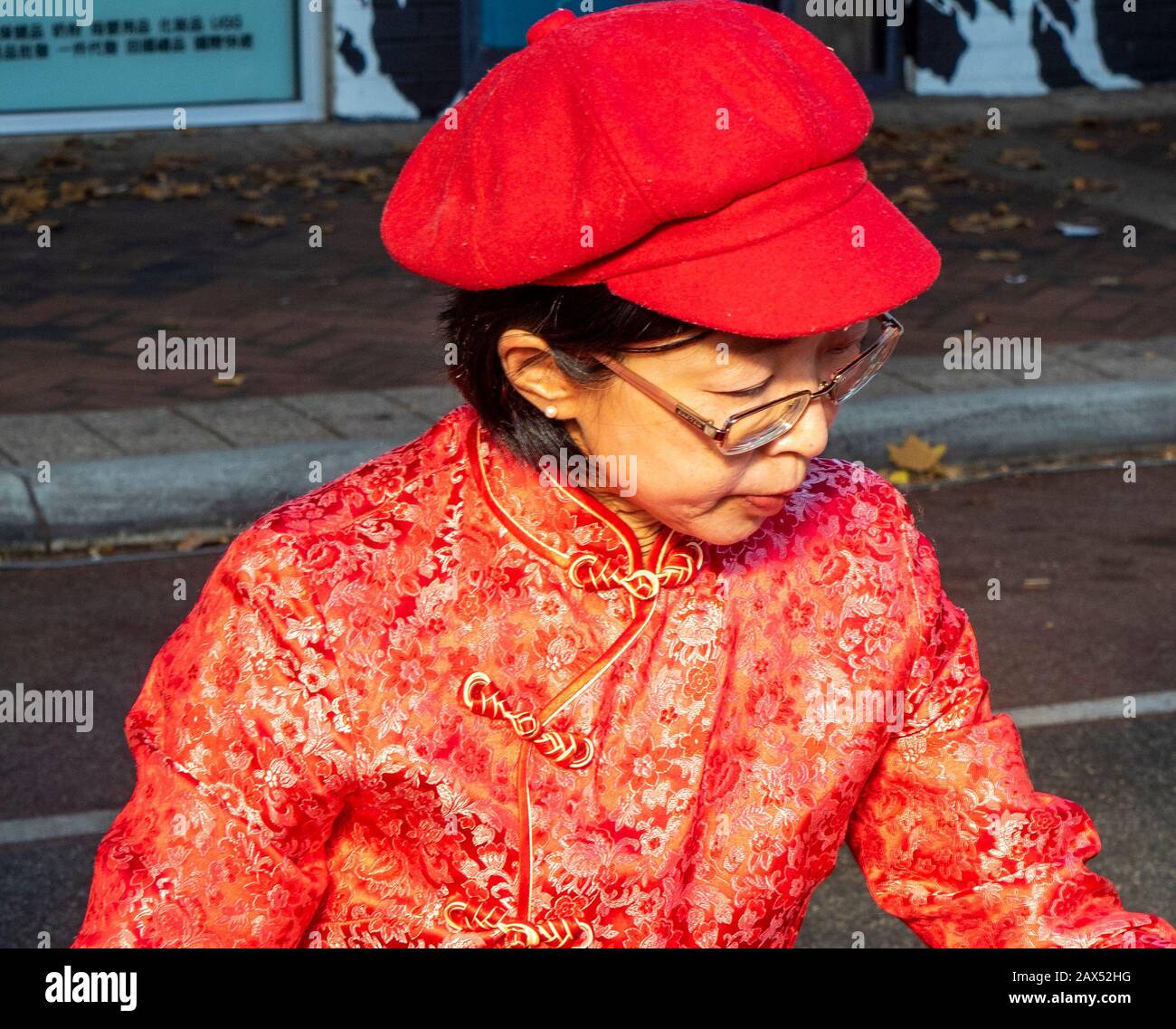 Chinese lady writing in Chinese characters names and spring couplets at ...