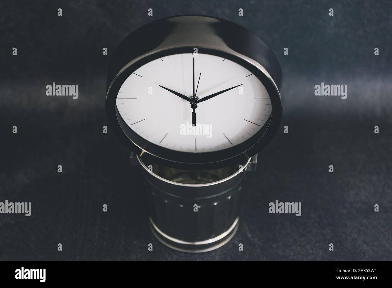 not wasting time conceptual still-life, oversize clock with miniature ...