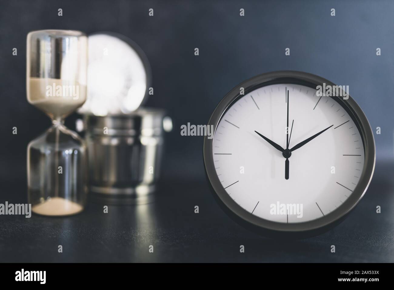 not wasting time conceptual still-life, oversize clock with miniature ...