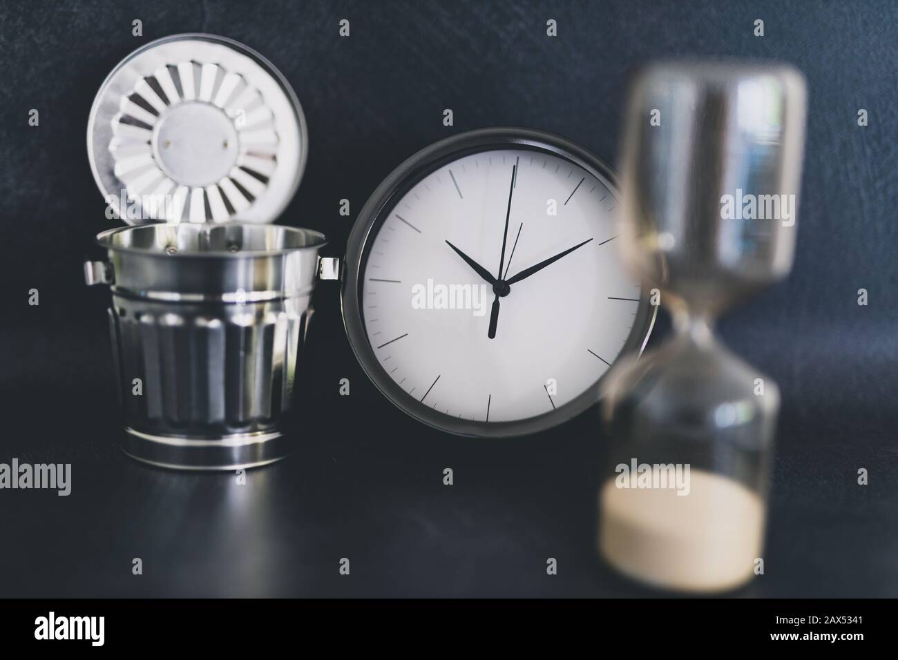 not wasting time conceptual still-life, oversize clock with miniature ...