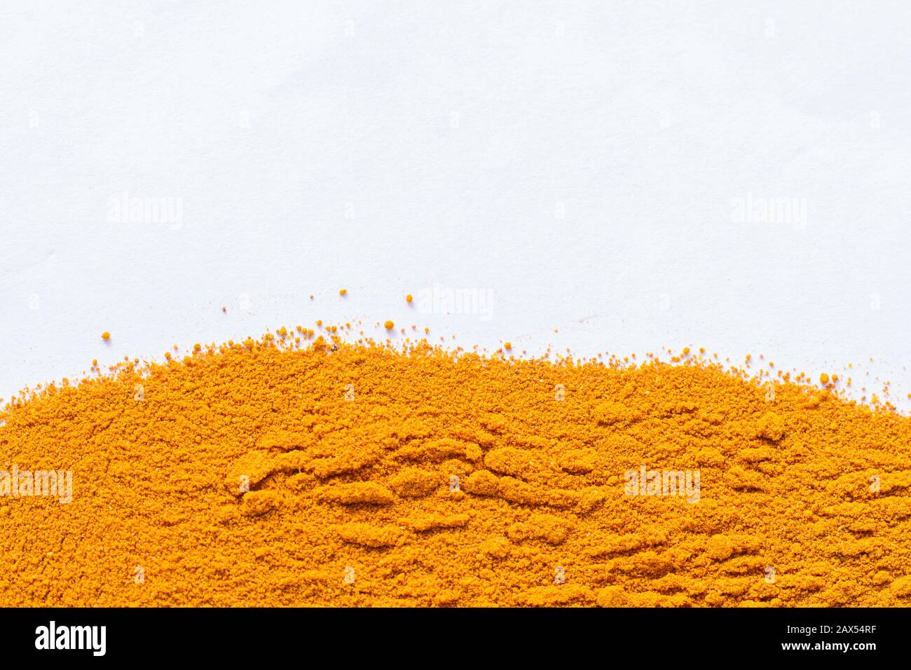 turmeric powder isolated on white background Stock Photo - Alamy