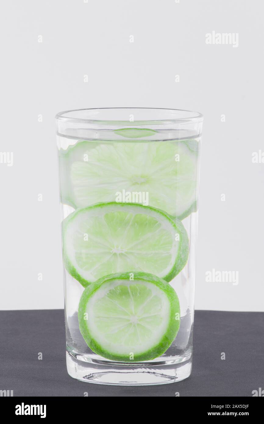 glass with water and lemon isolated on white background Stock Photo - Alamy
