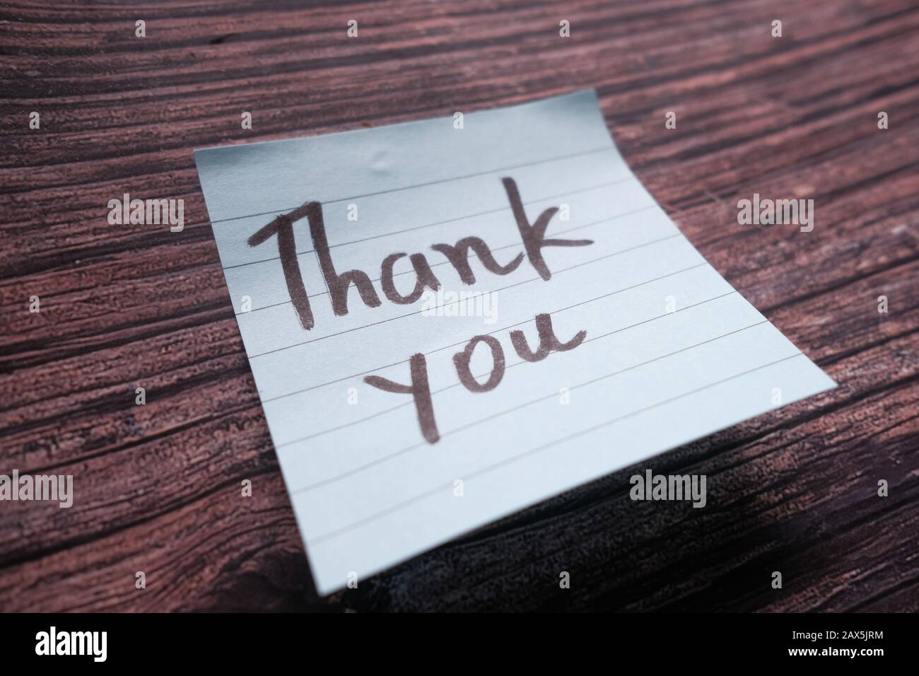 hand written thank you message on paper on table Stock Photo - Alamy