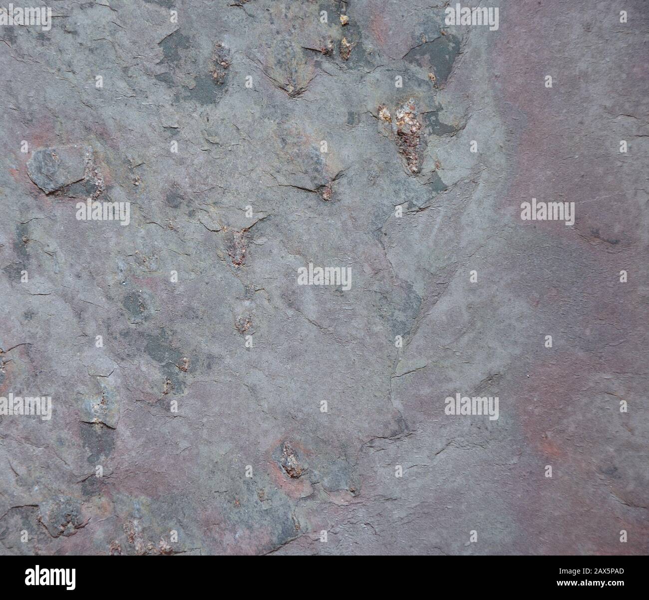 The texture of natural stone with traces of erosion and delamination on ...