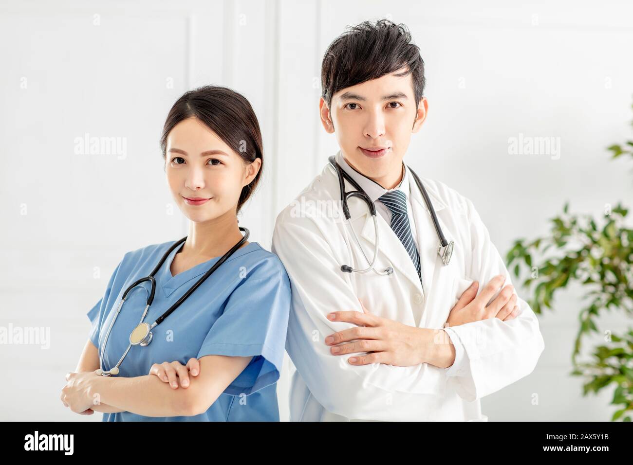 Two smart and professional smiling doctors Stock Photo - Alamy