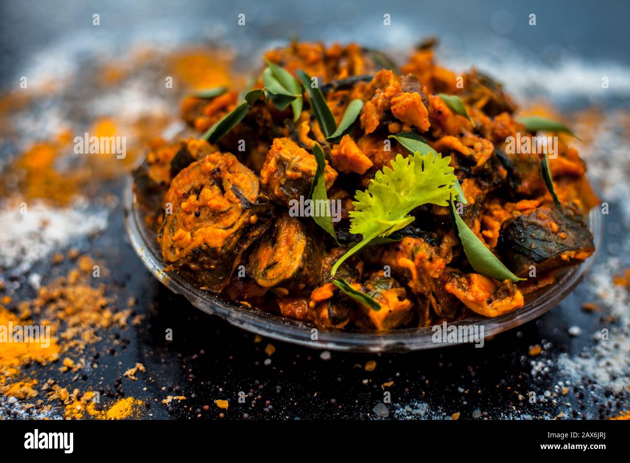 Famous Indian & Gujarati snack dish in a glass plate on wooden surface ...