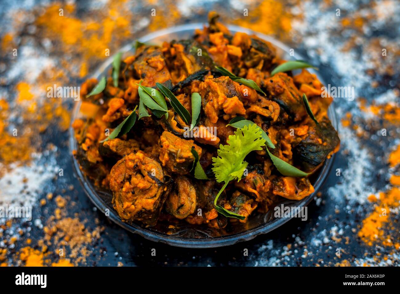 Famous Indian & Gujarati snack dish in a glass plate on wooden surface ...