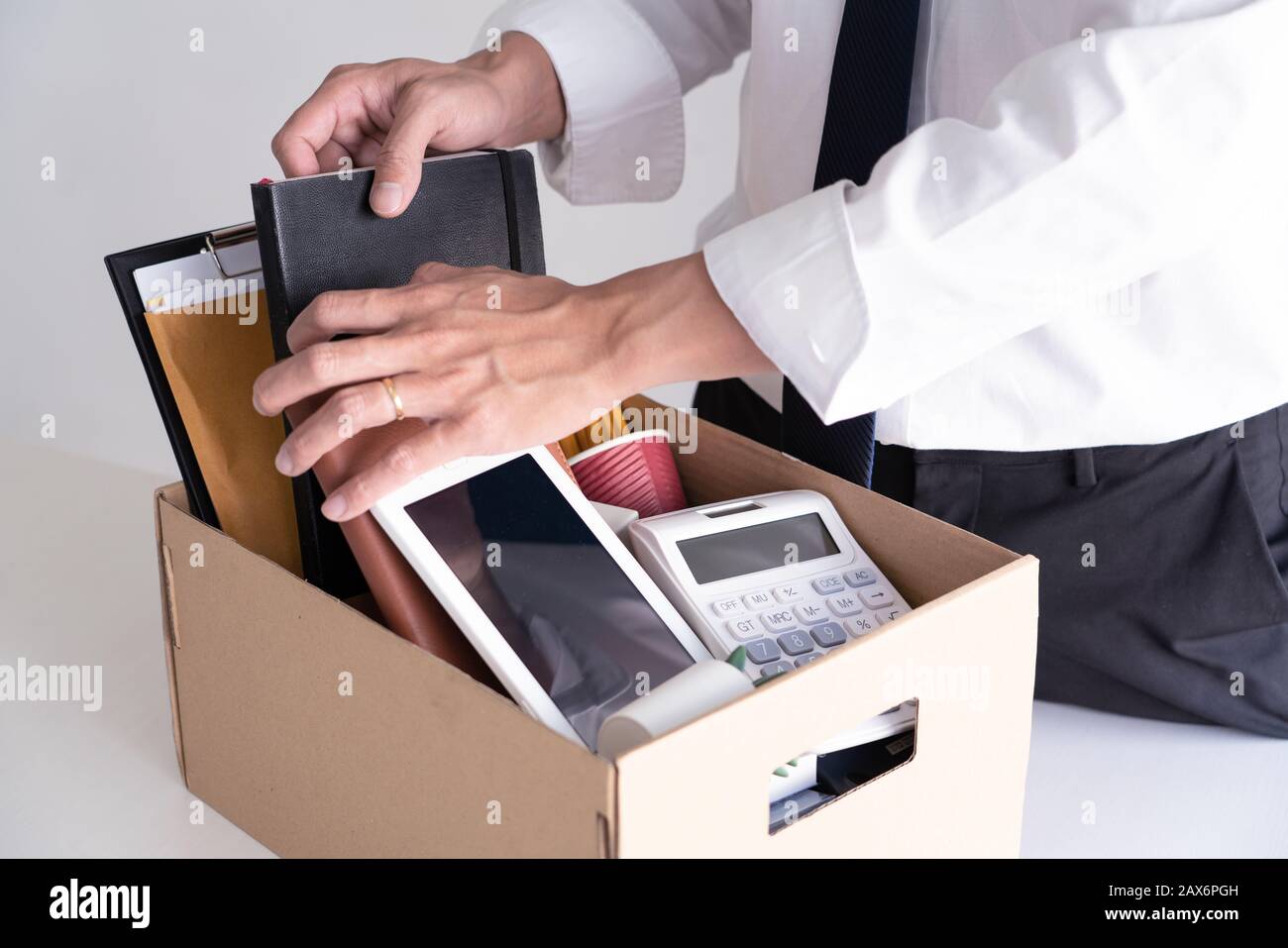 Businessmen are holding resignation document and packing personal ...