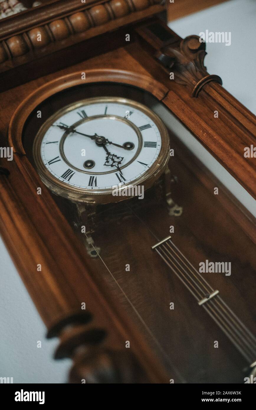 Dutch angle shot of an old wooden grandfather clock Stock Photo - Alamy