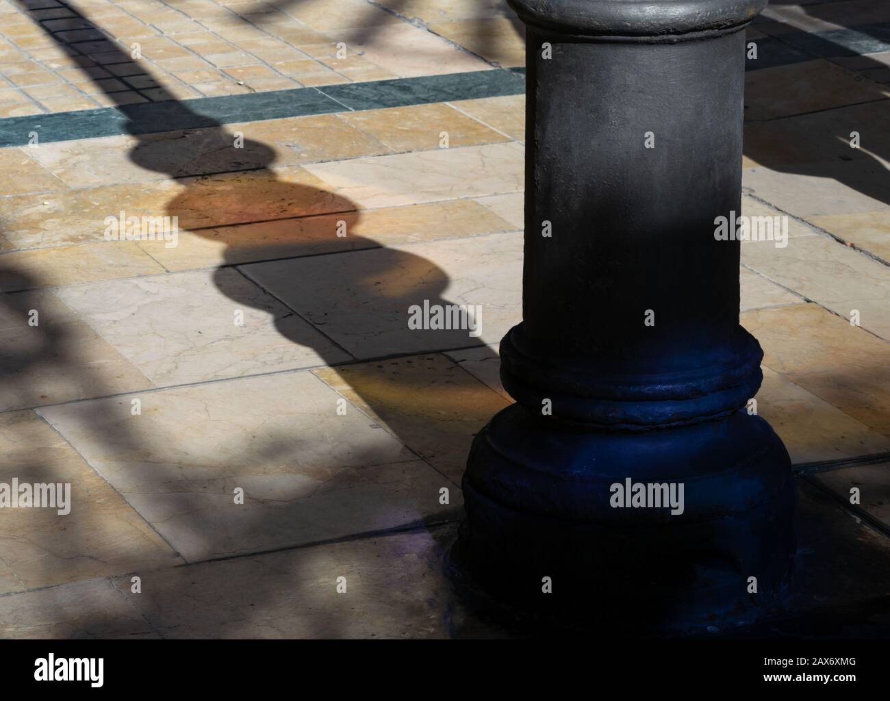 Shadow f a black street light during daytime Stock Photo - Alamy