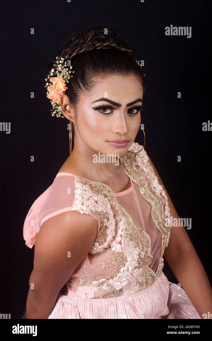 Model girl with elegant hairstyle. Face Close-up, looking at camera ...