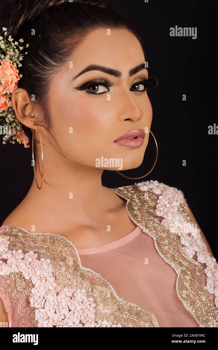 Model girl with elegant hairstyle. Face Close-up, looking at camera ...