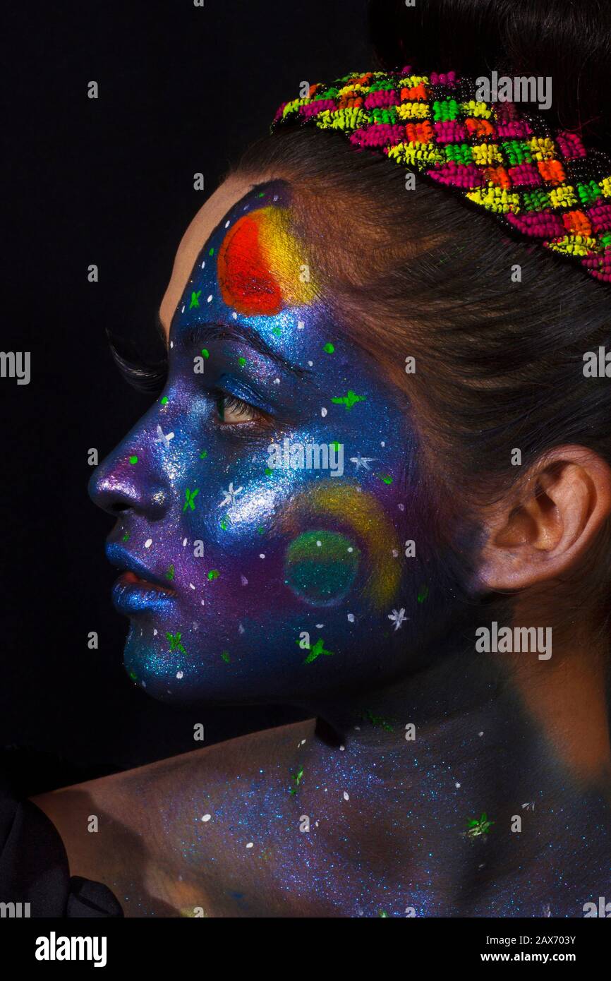 Studio shot of model girl portrait with abstract colorful make-up, face ...