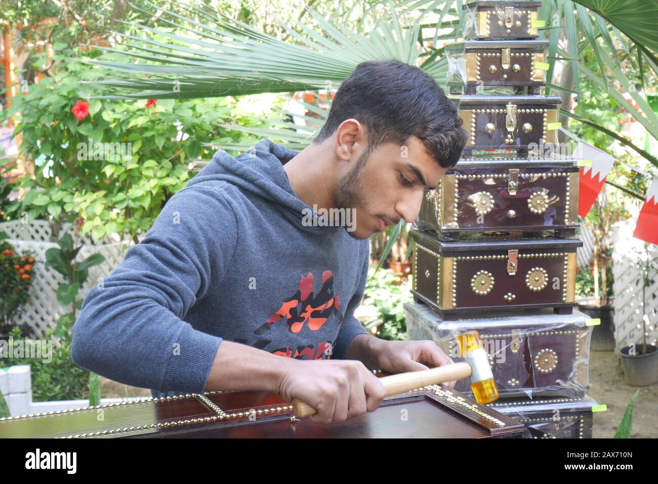 Bahrain craftsman using a hammer to make traditional boxes, Bahrain ...