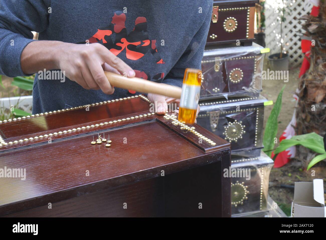 Bahrain craftsman using a hammer to make traditional boxes, Bahrain ...