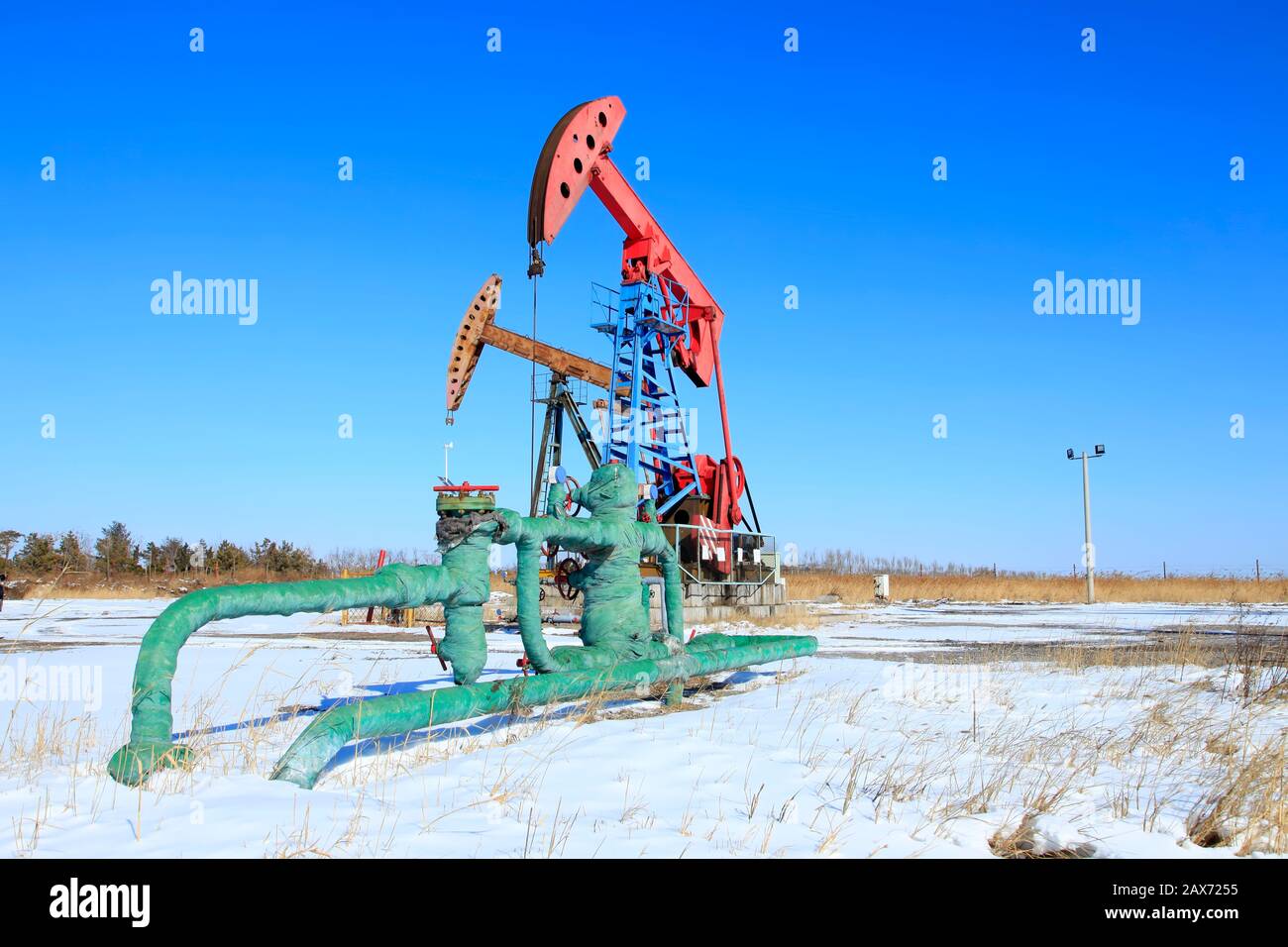 Oil field, oil pump in the work Stock Photo - Alamy