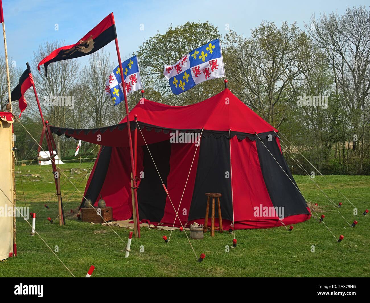 Medieval red and black war tent with normandy flags waving Stock Photo ...