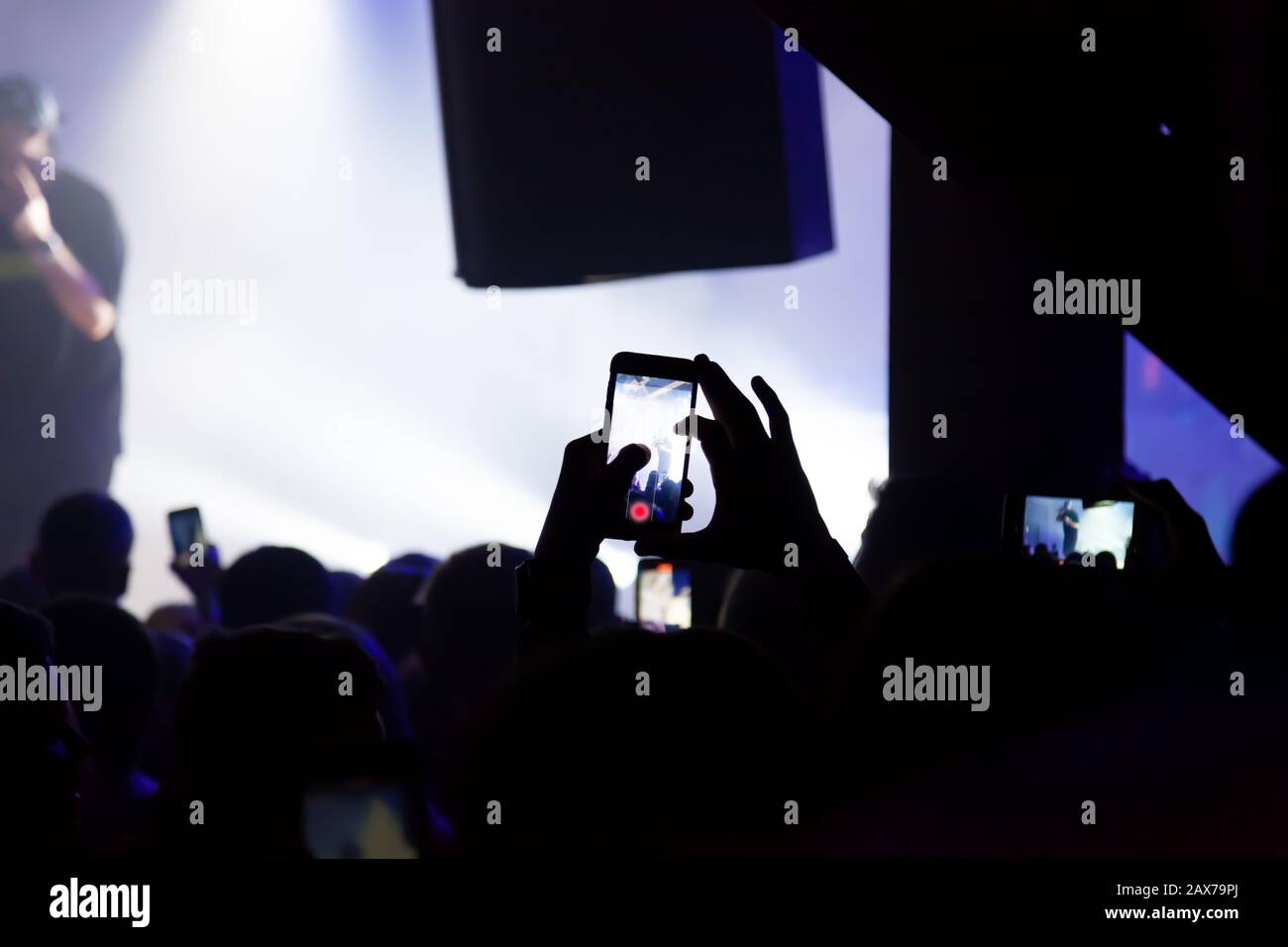 Hand with a smartphone records live music festival, Taking photo of ...