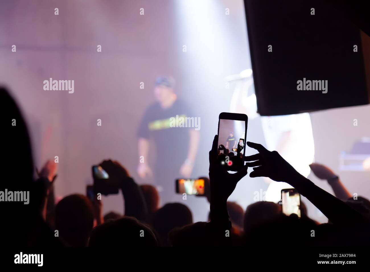 Hand with a smartphone records live music festival, Taking photo of ...