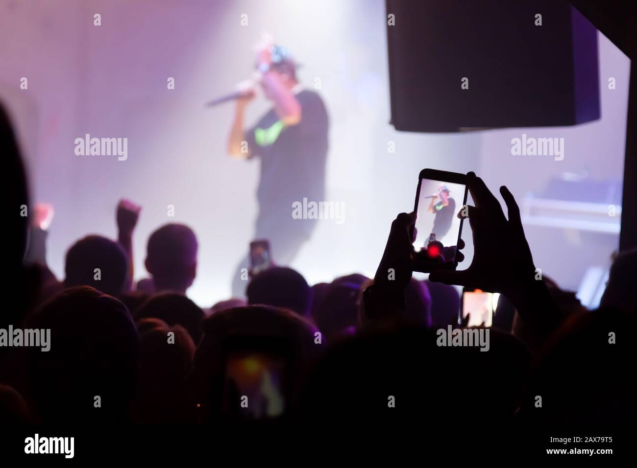 Hand with a smartphone records live music festival, Taking photo of ...