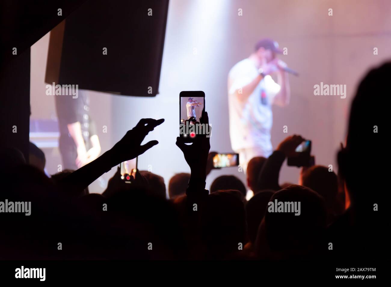 Hand with a smartphone records live music festival, Taking photo of ...