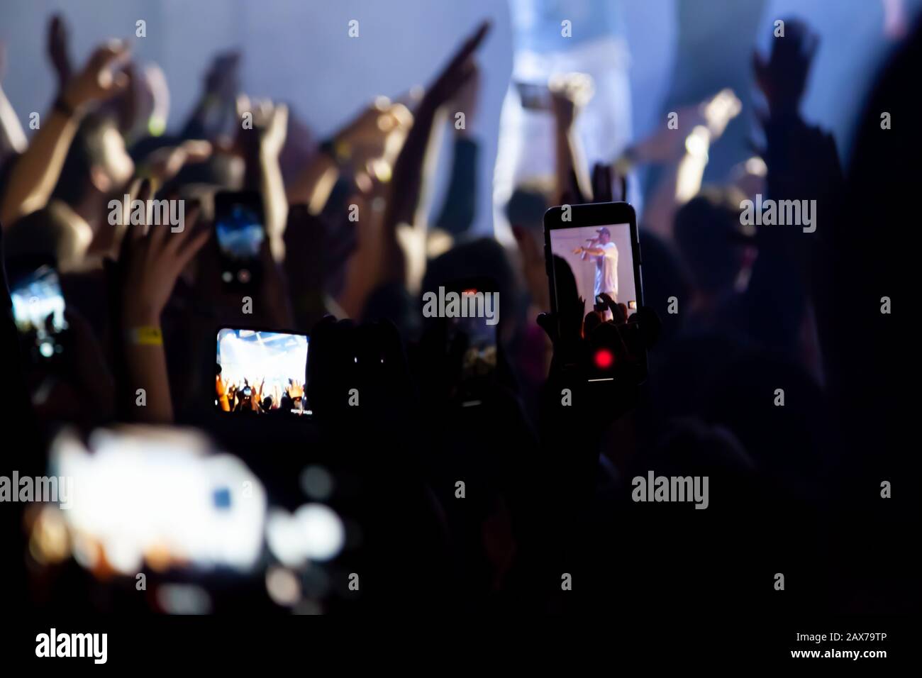 Hand with a smartphone records live music festival, Taking photo of ...