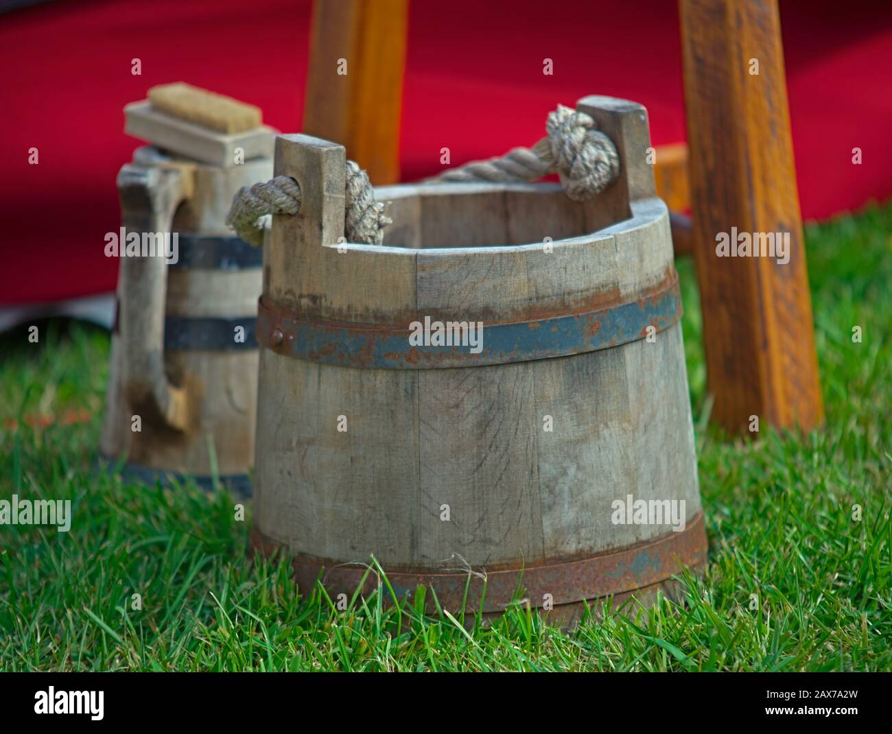 Medieval wooden bucket standing on grass Stock Photo - Alamy