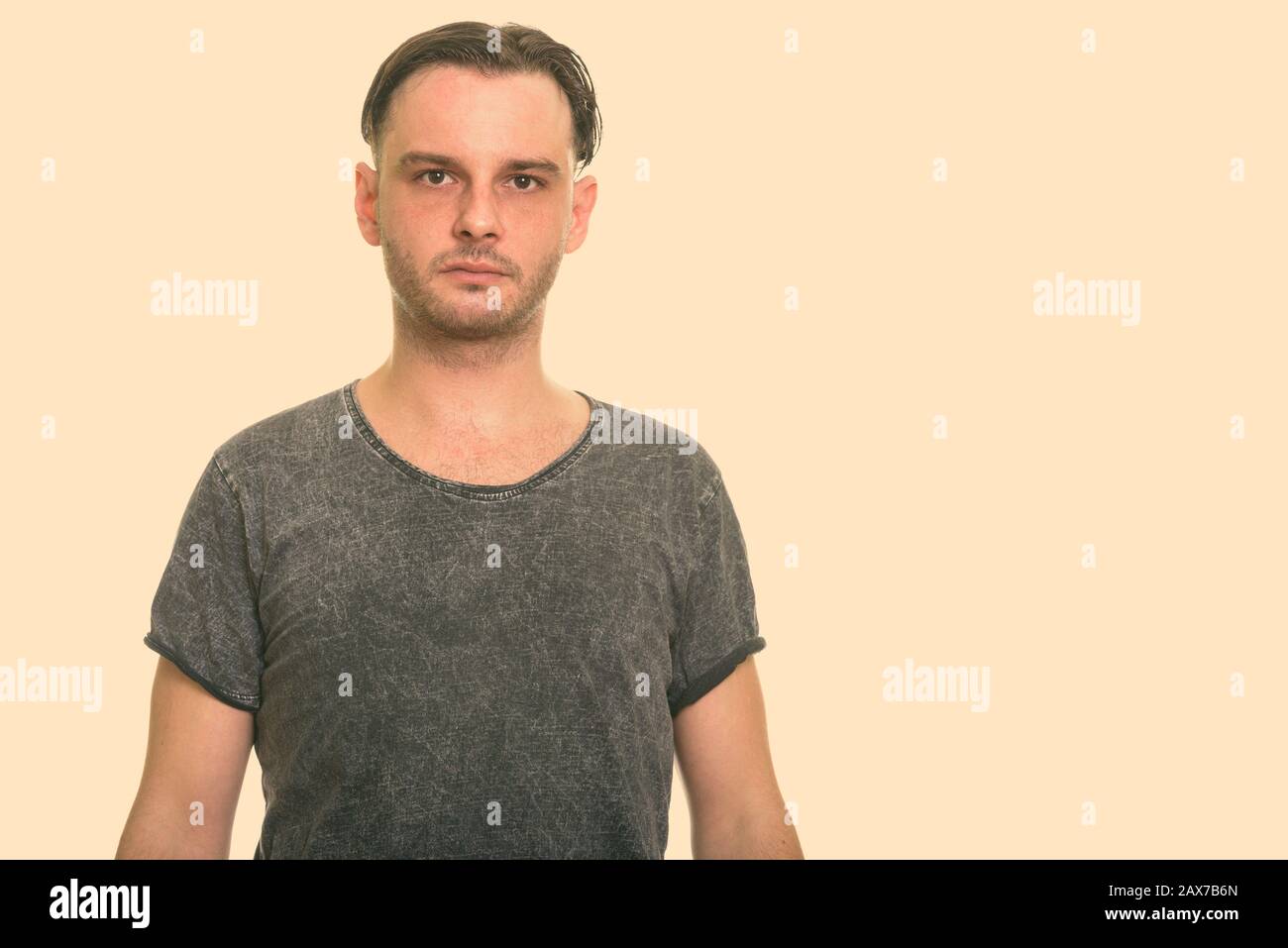 Portrait of young man with beard stubble Stock Photo - Alamy