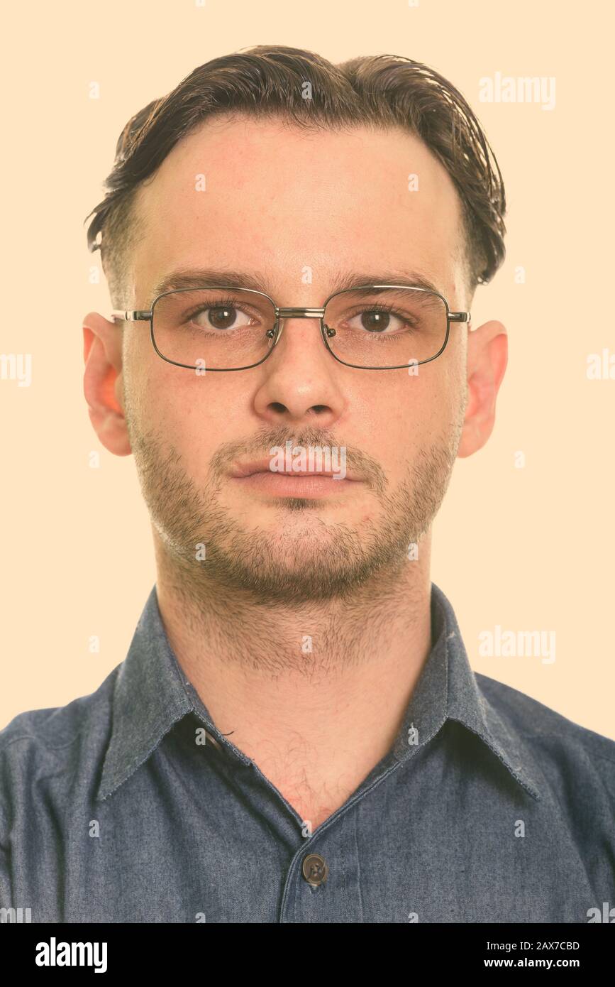 Face of formal young man wearing eyeglasses Stock Photo - Alamy