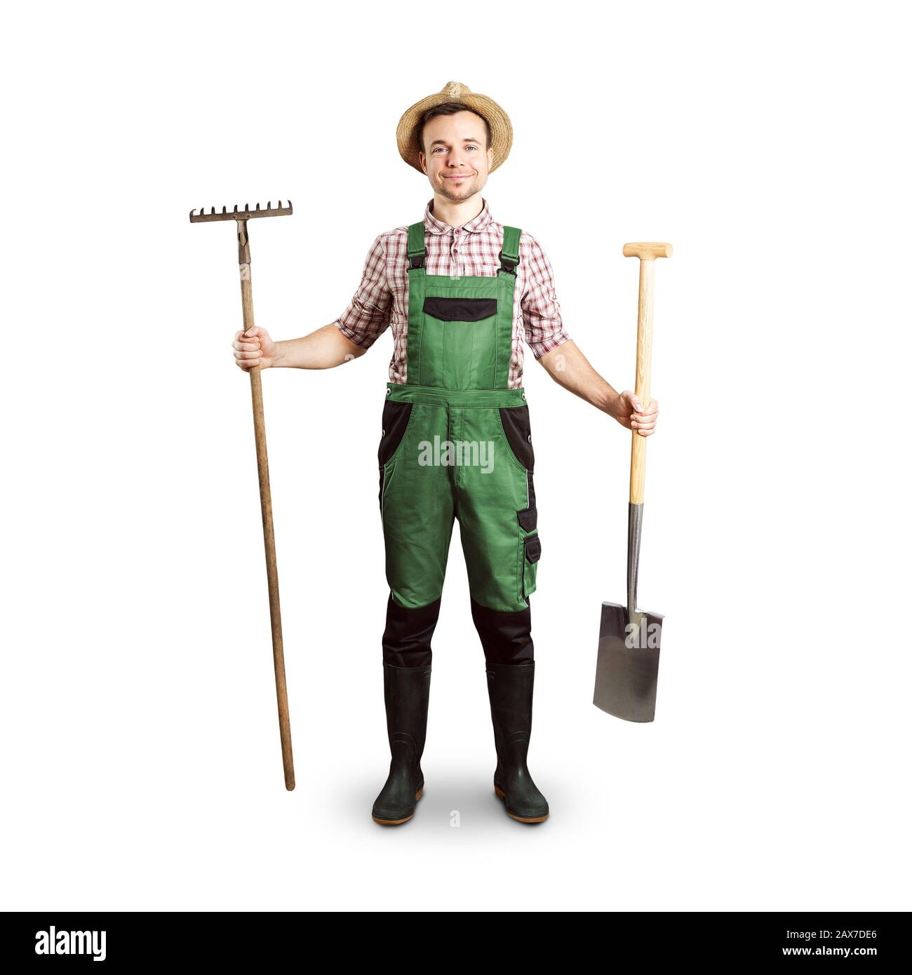 Happy gardener holding a rake and a spade - white background Stock ...