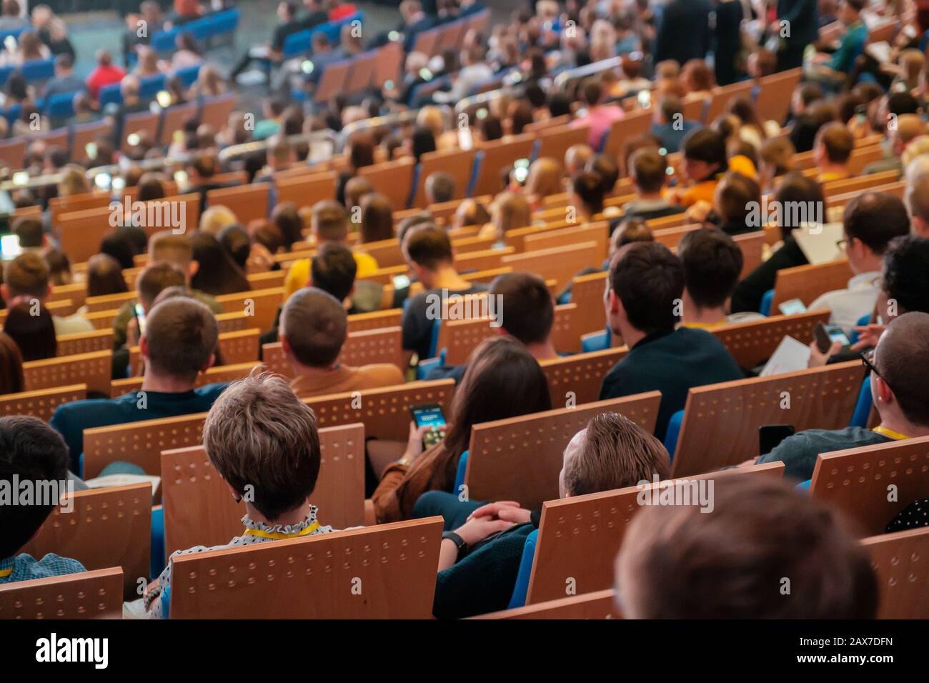 Business conference attendees sit and listen Stock Photo - Alamy
