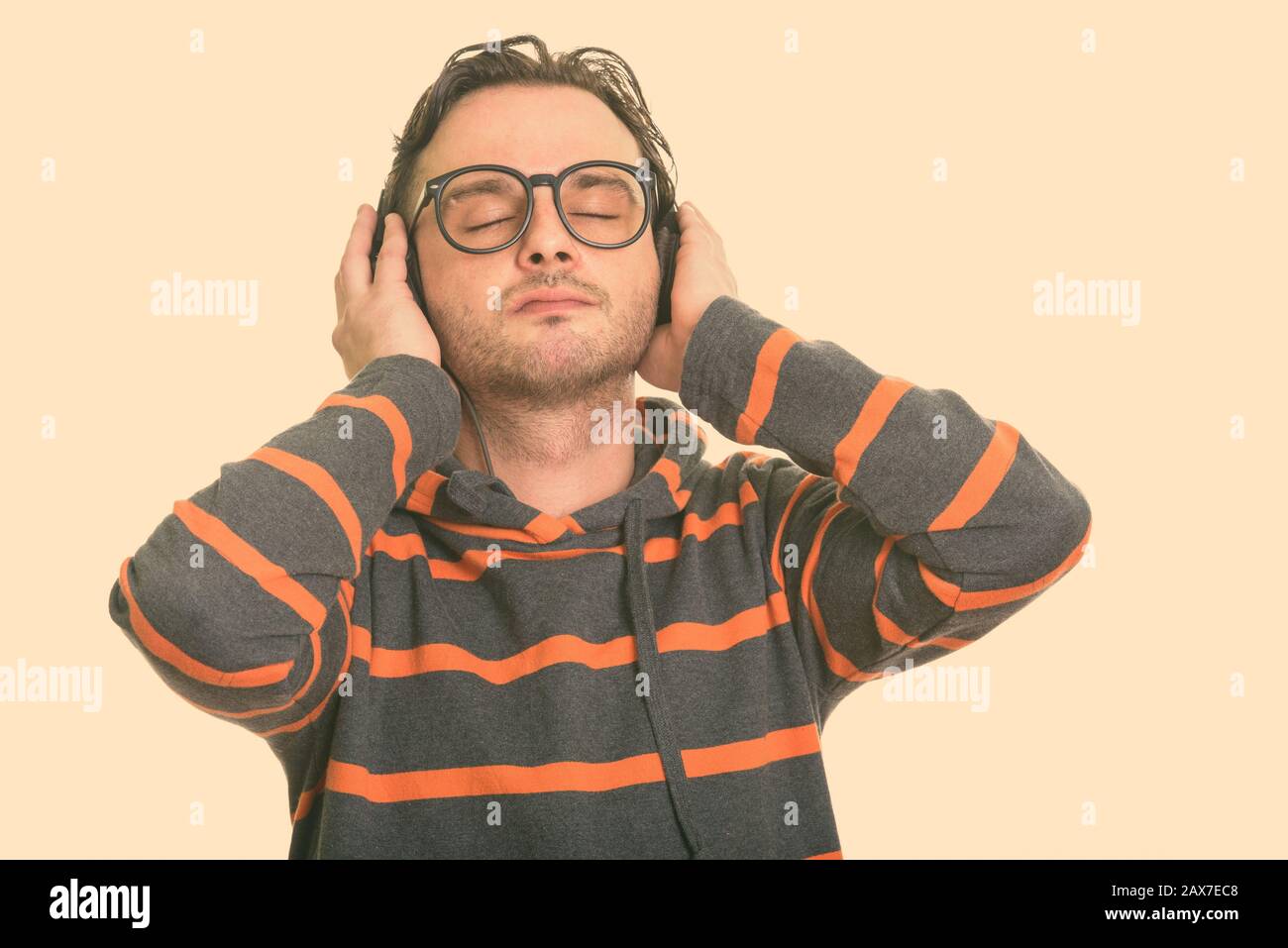 Studio shot nerd man listening hi-res stock photography and images - Alamy