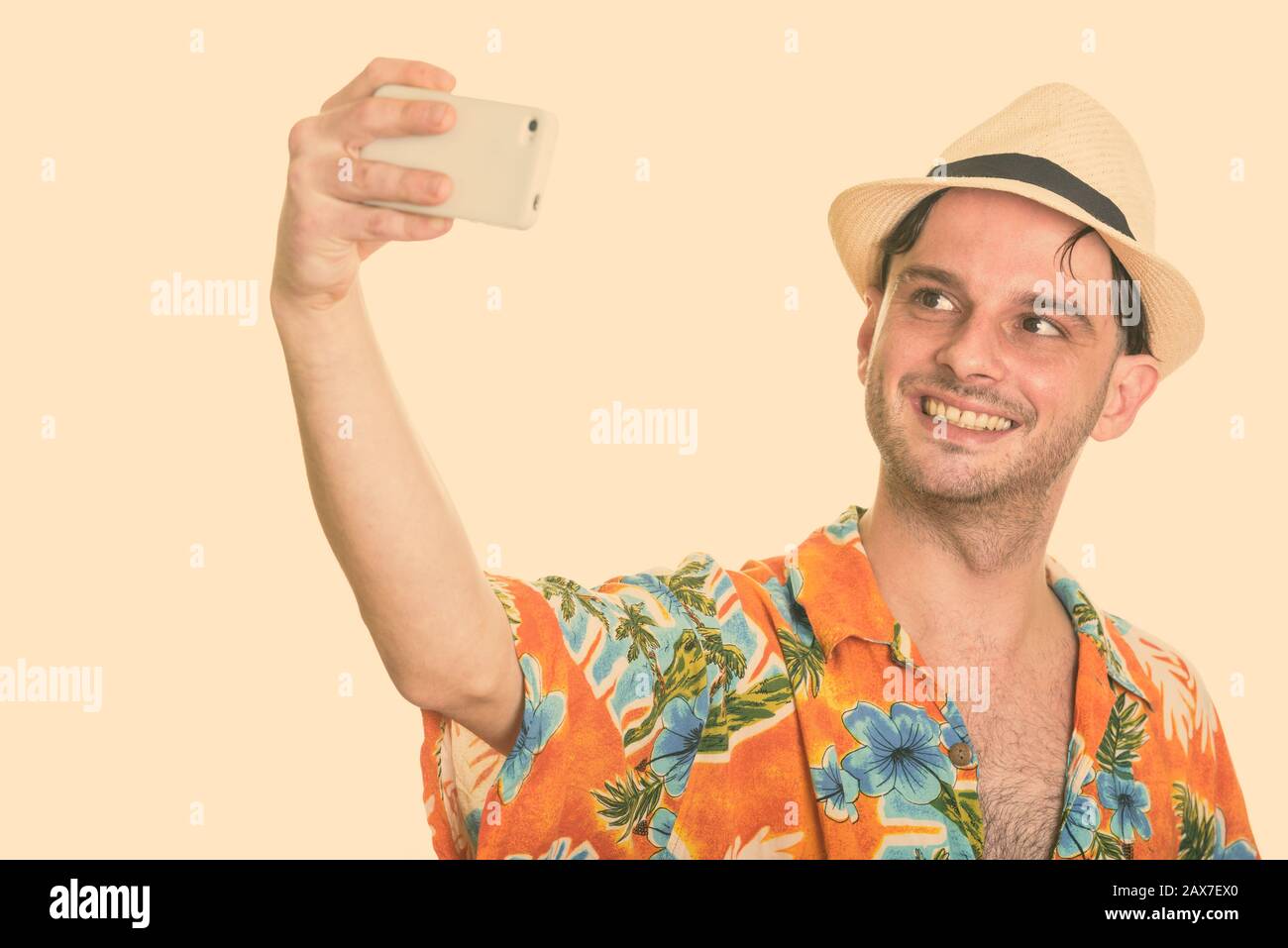 Happy young man with smartphone hi-res stock photography and images - Alamy