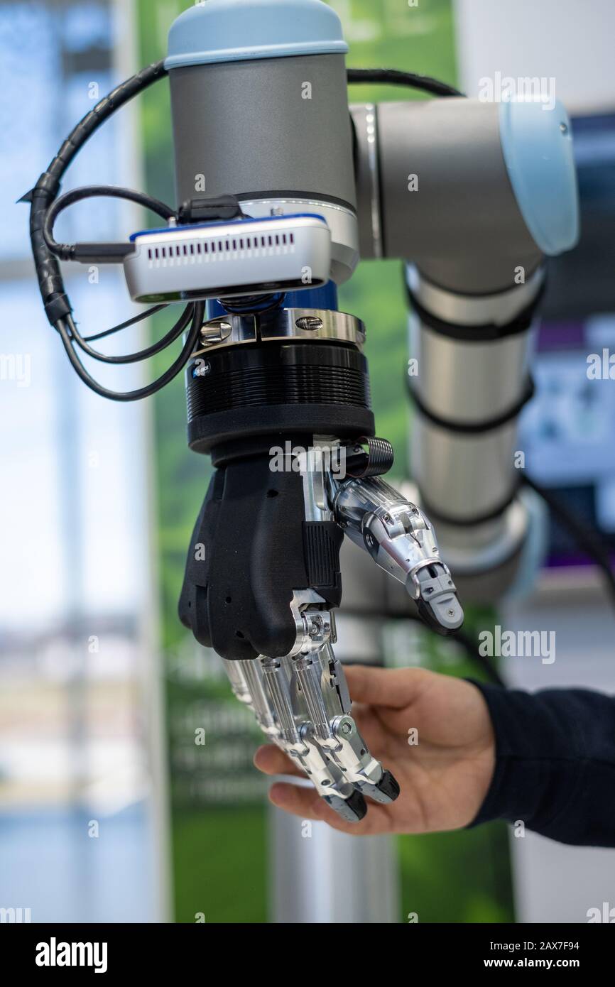 Human hand and robotic arm Stock Photo - Alamy