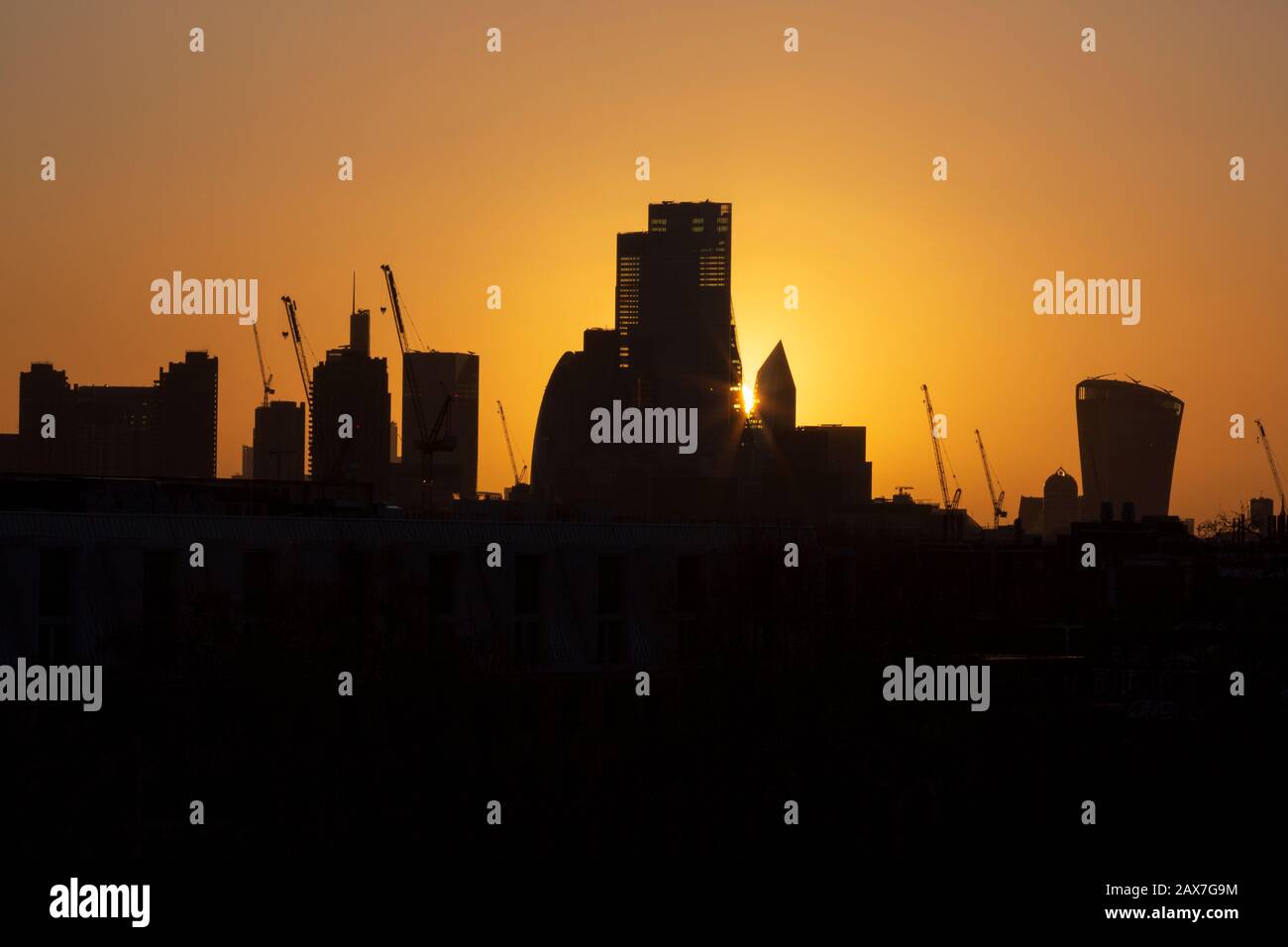 London. 11th Feb 2020. UK Weather: Sun rises behind the City of London ...