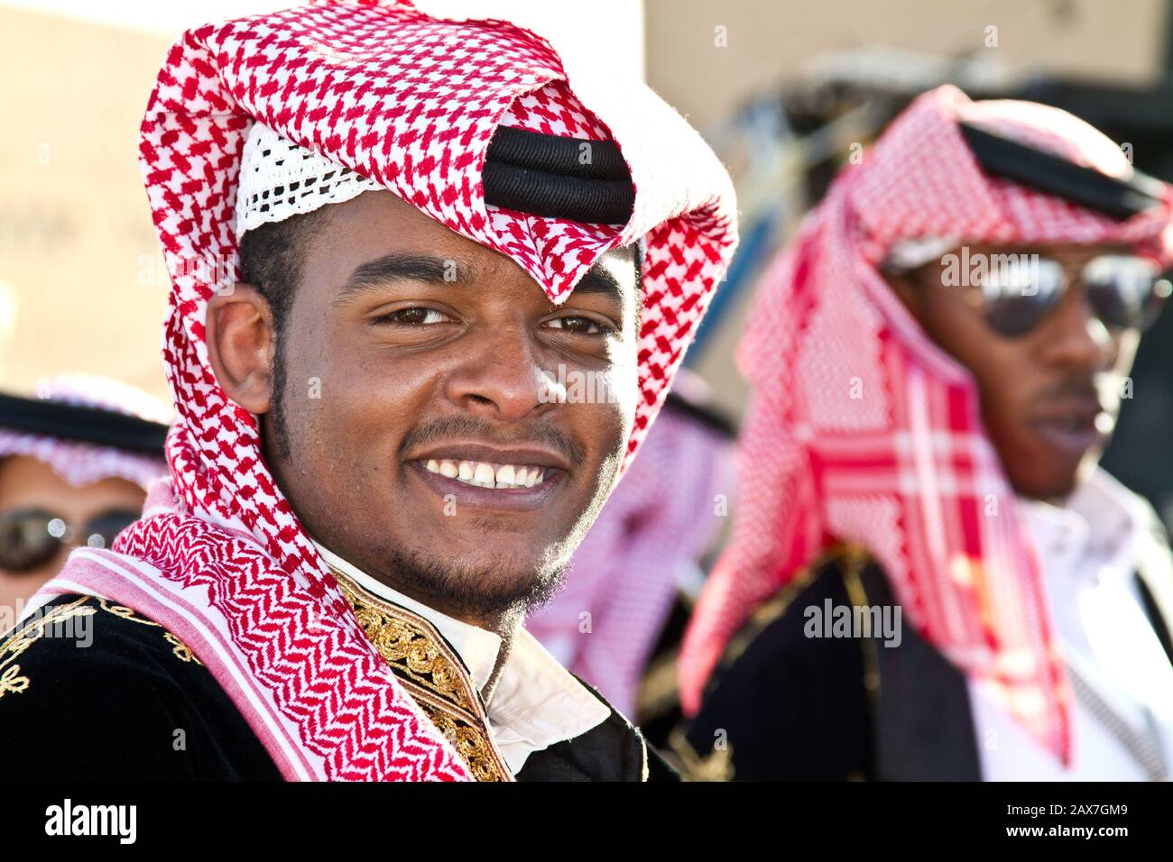 Young Saudi man smiling Stock Photo - Alamy