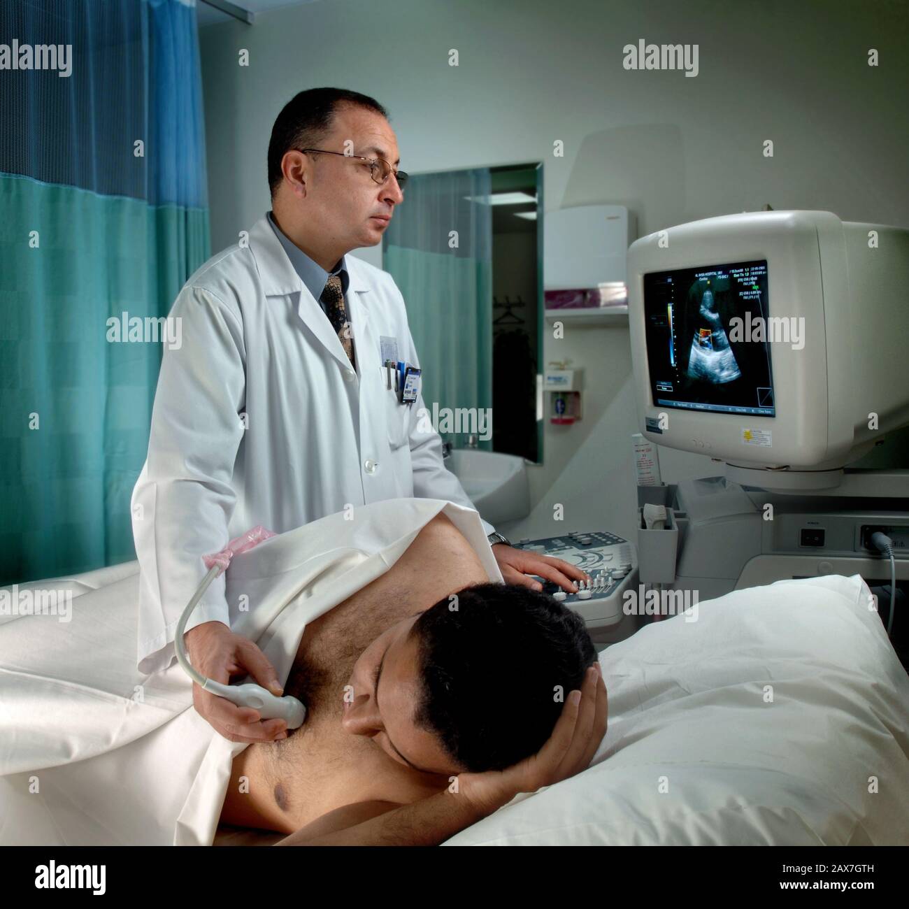 A doctor examining a patient in a hospital in Khobar, Saudi Arabia ...