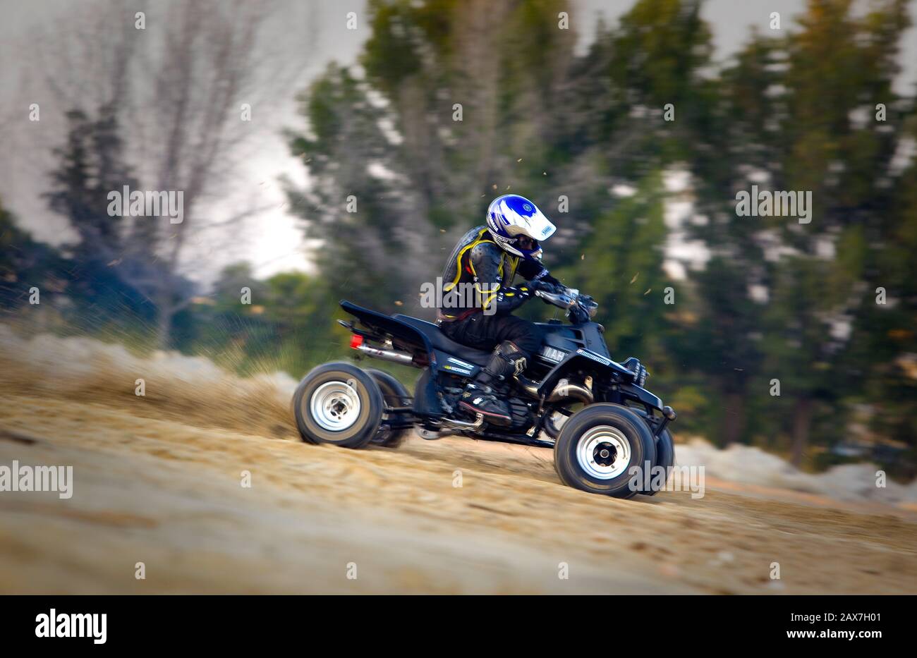 A man on a quad bike in Saudi Arabia Stock Photo - Alamy