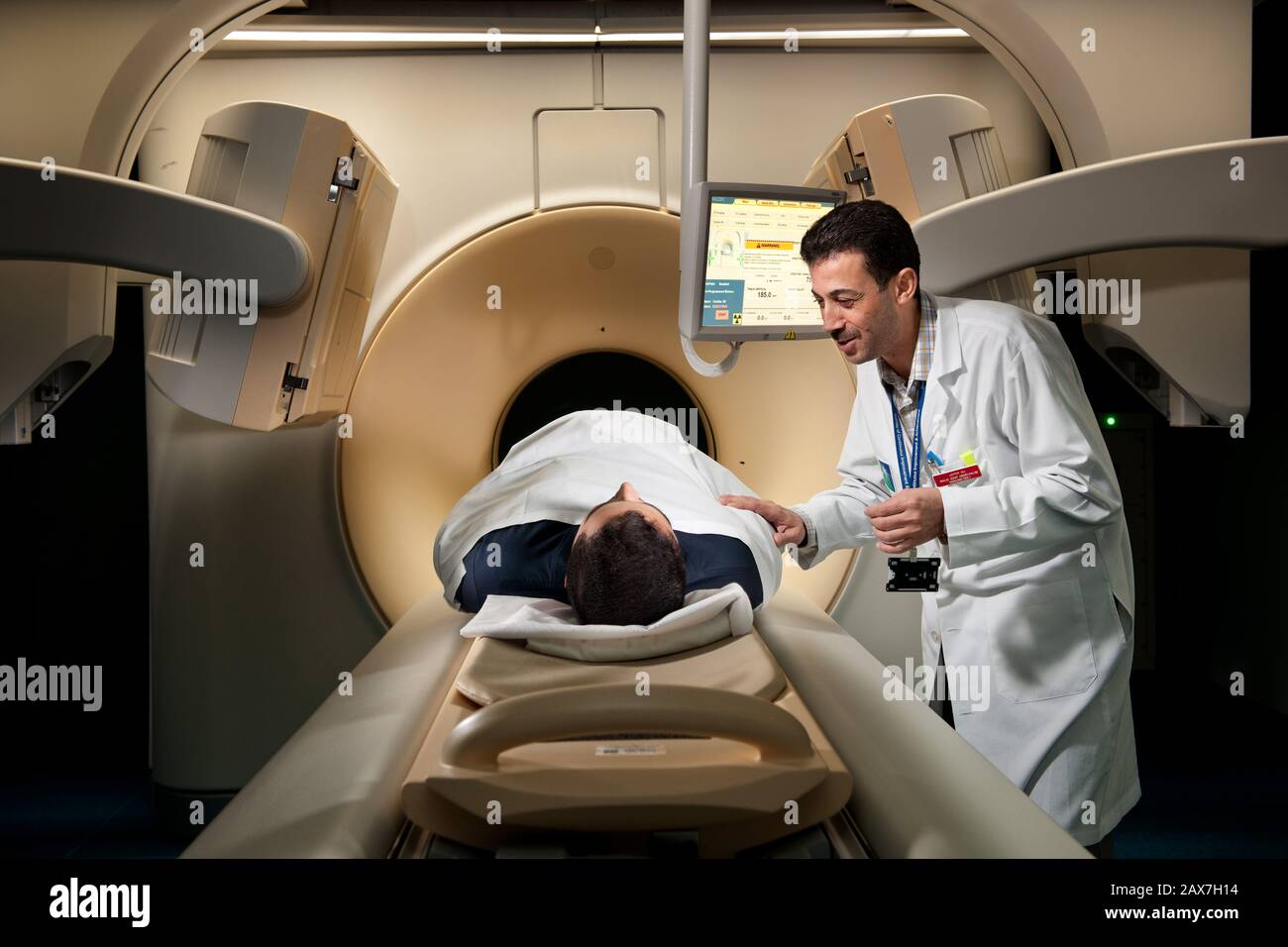 Patient entering into CT scanner in hospital, Saudi Arabia Stock Photo ...
