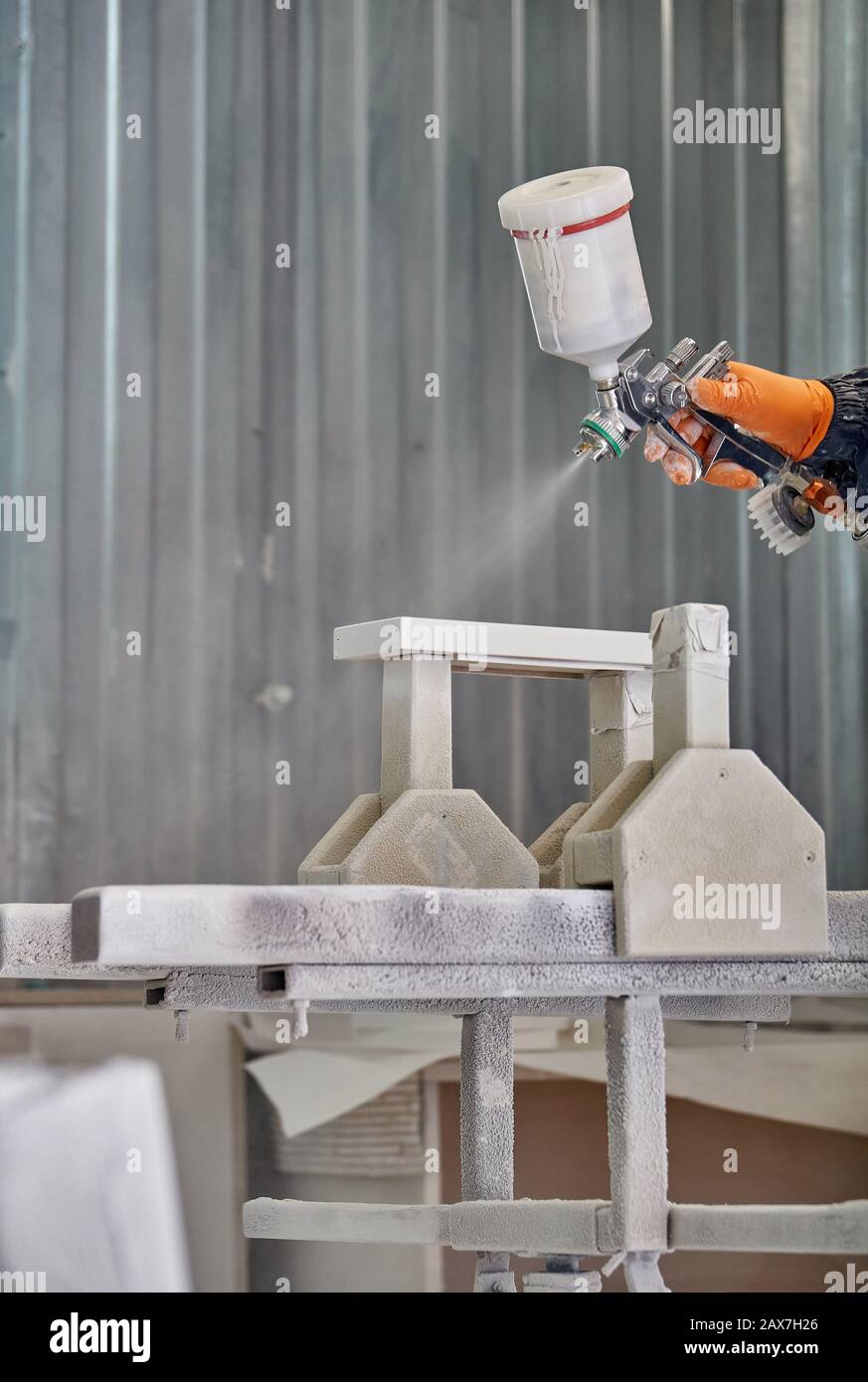 Painting furniture in a spray booth. Furniture manufacture. Wooden ...