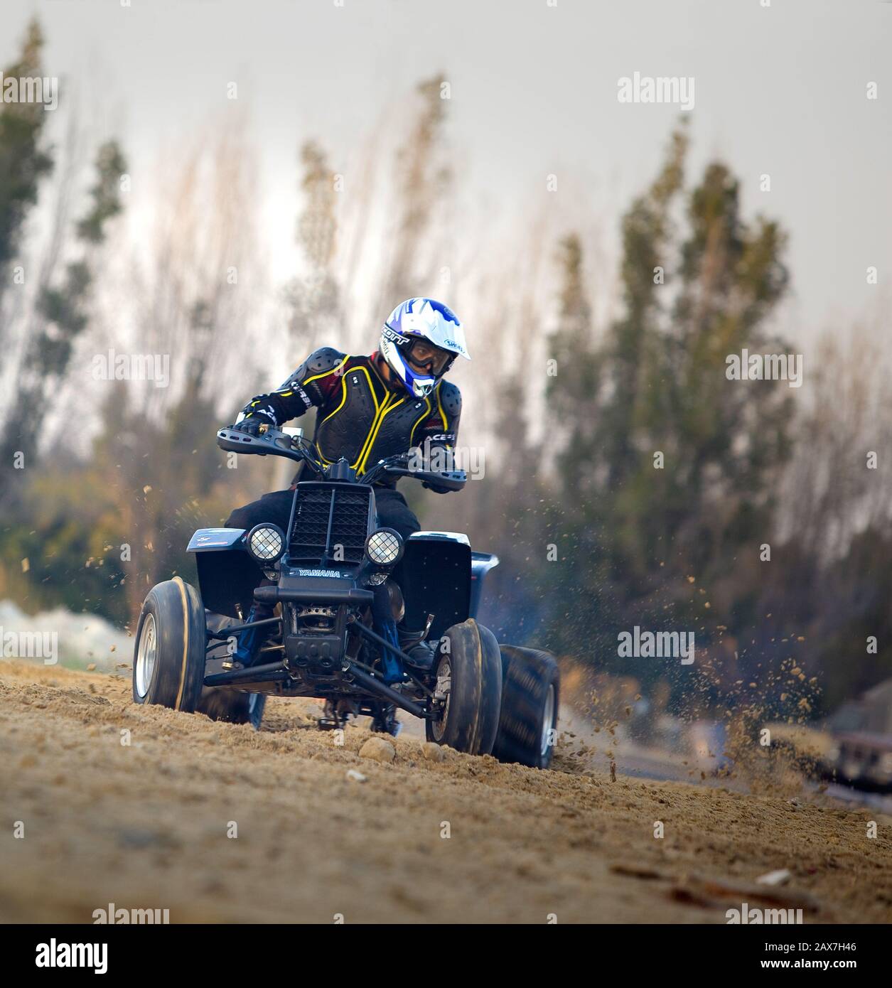 A man on a quad bike in Saudi Arabia Stock Photo - Alamy