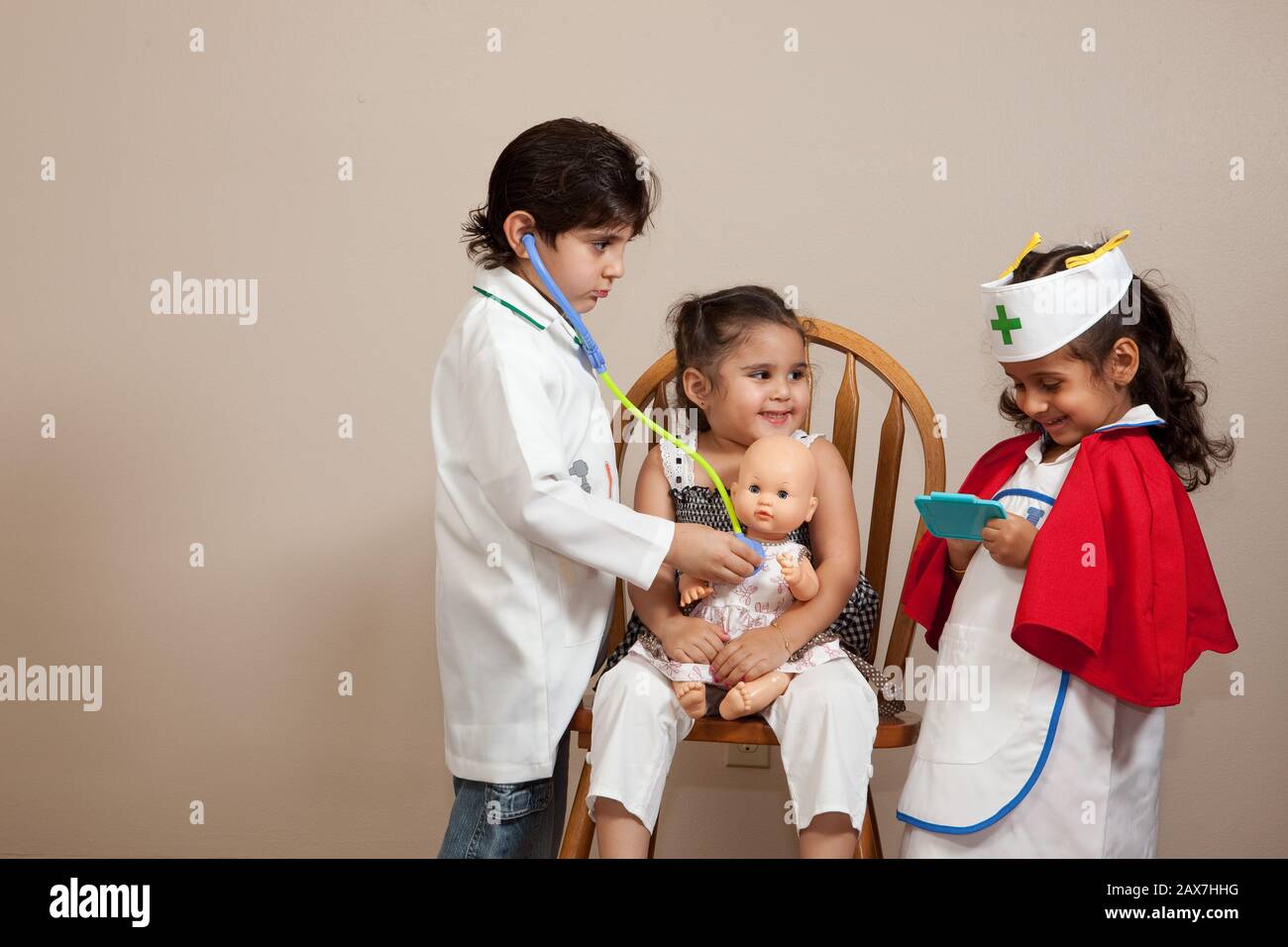 Children playing as doctor, nurse and patient Stock Photo - Alamy