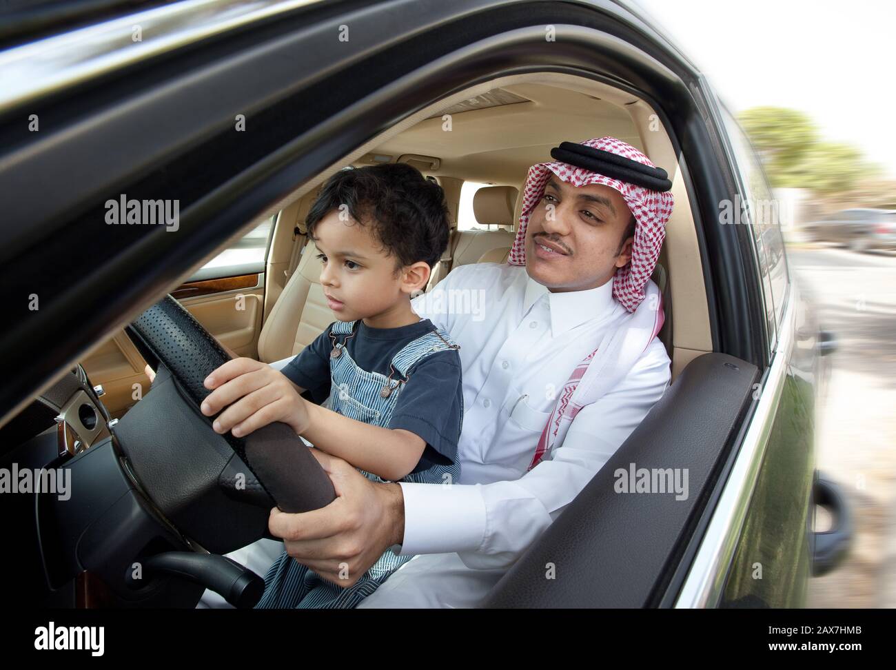 Father teaching son how to drive car Stock Photo - Alamy