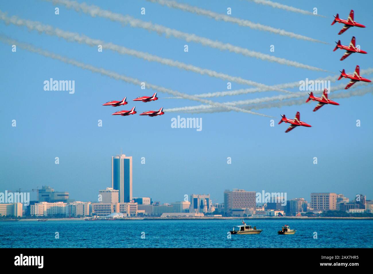 Red arrow performing an aerobatic display over Manama, Bahrain Stock ...